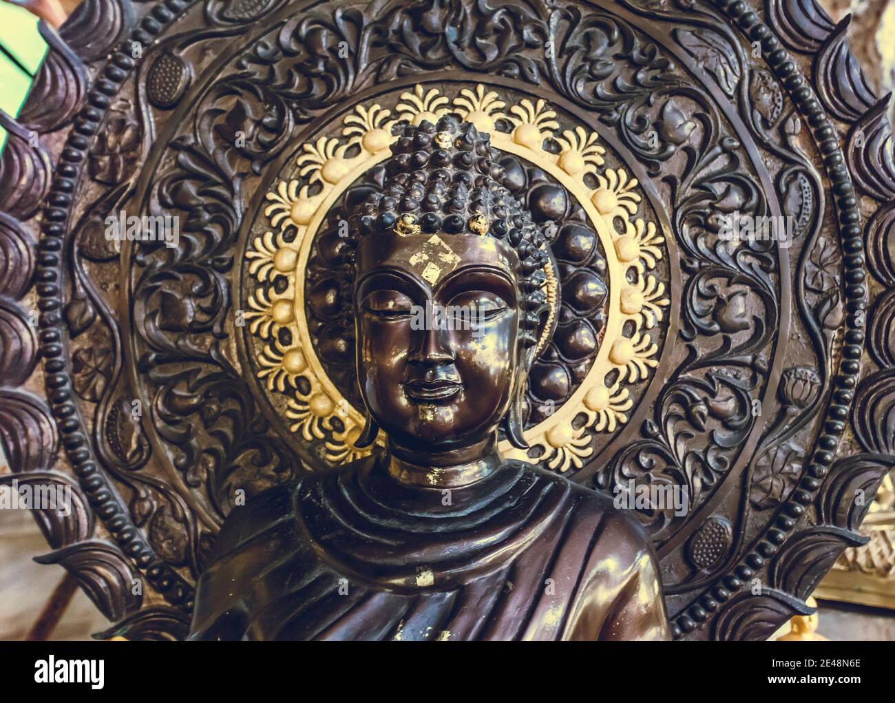 Closeup Thailand buddhism statue: bust Buddha monument with ornament circle background in temple ...