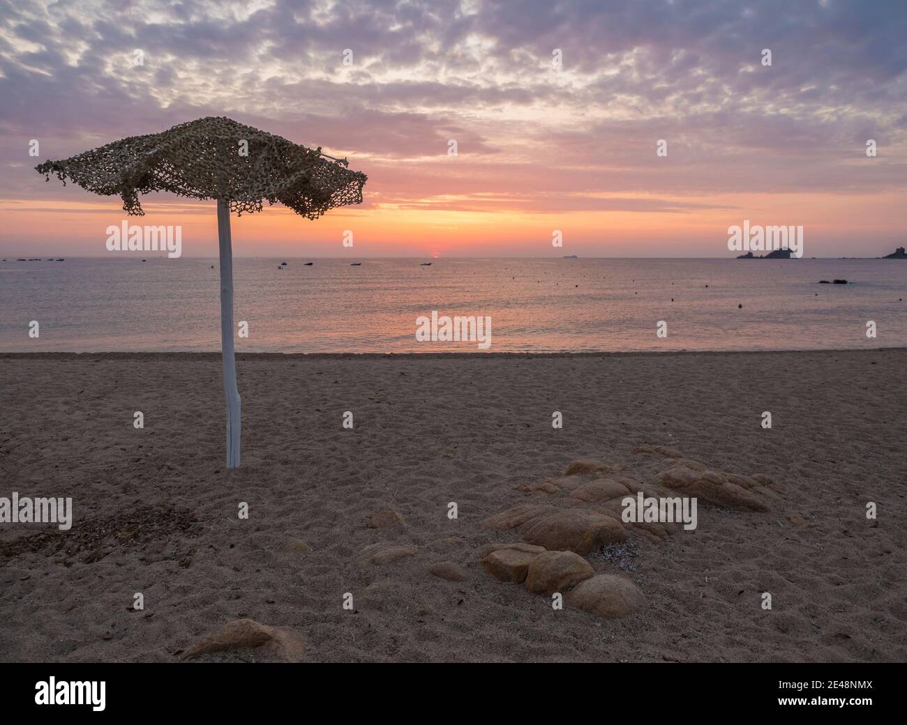 Colorful sunrise at empty beach Spiaggia di Santa Maria Navarrese with ...