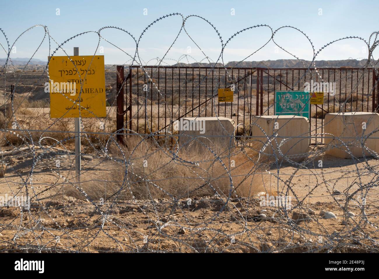 Coiled barbed wire fence at the Israeli border with Jordan in the ...
