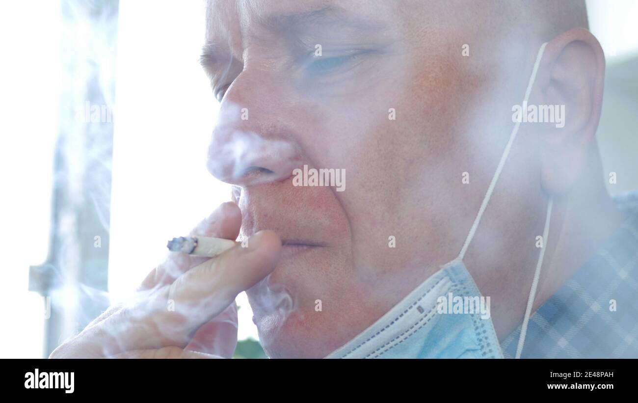 Man smoking cigarette at bar hi-res stock photography and images - Alamy