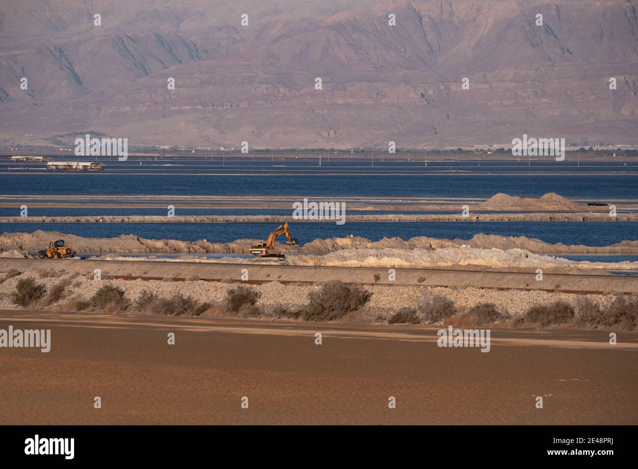 Bulldozers ditching at the evaporation ponds operated by the 'Dead Sea ...