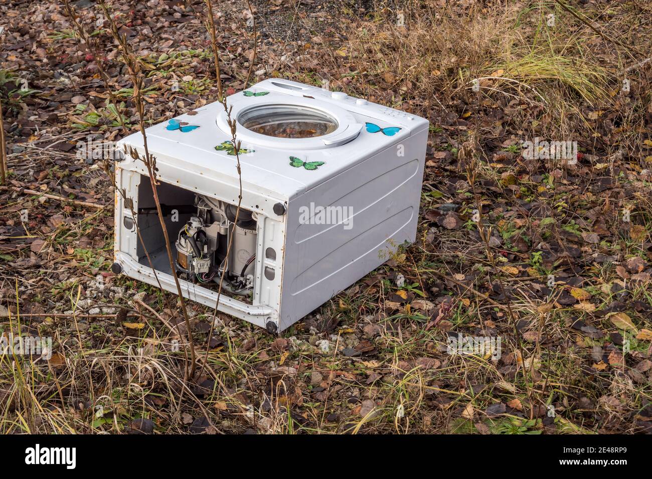 illegal e-waste disposal of a washing machine Stock Photo - Alamy