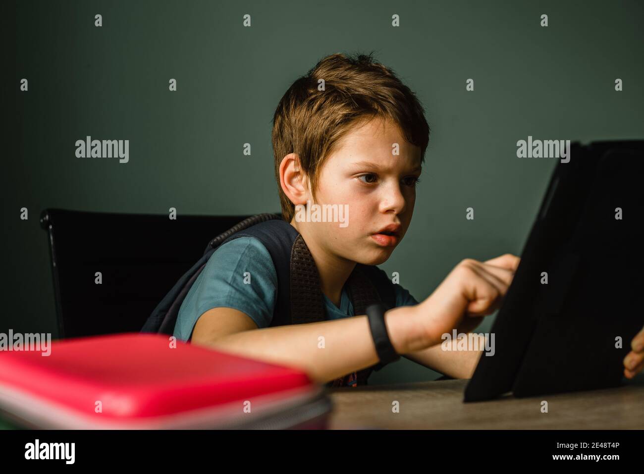 School boy playing tablet at home, growing up with technology Stock ...