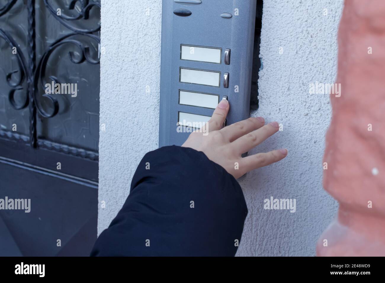 Woman Ringing Doorbell High Resolution Stock Photography and Images - Alamy