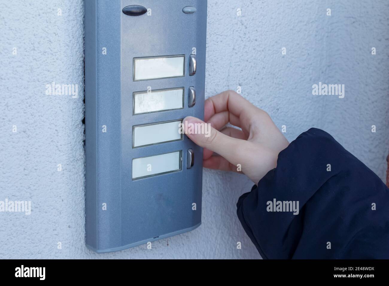 Woman Ringing Doorbell High Resolution Stock Photography and Images - Alamy