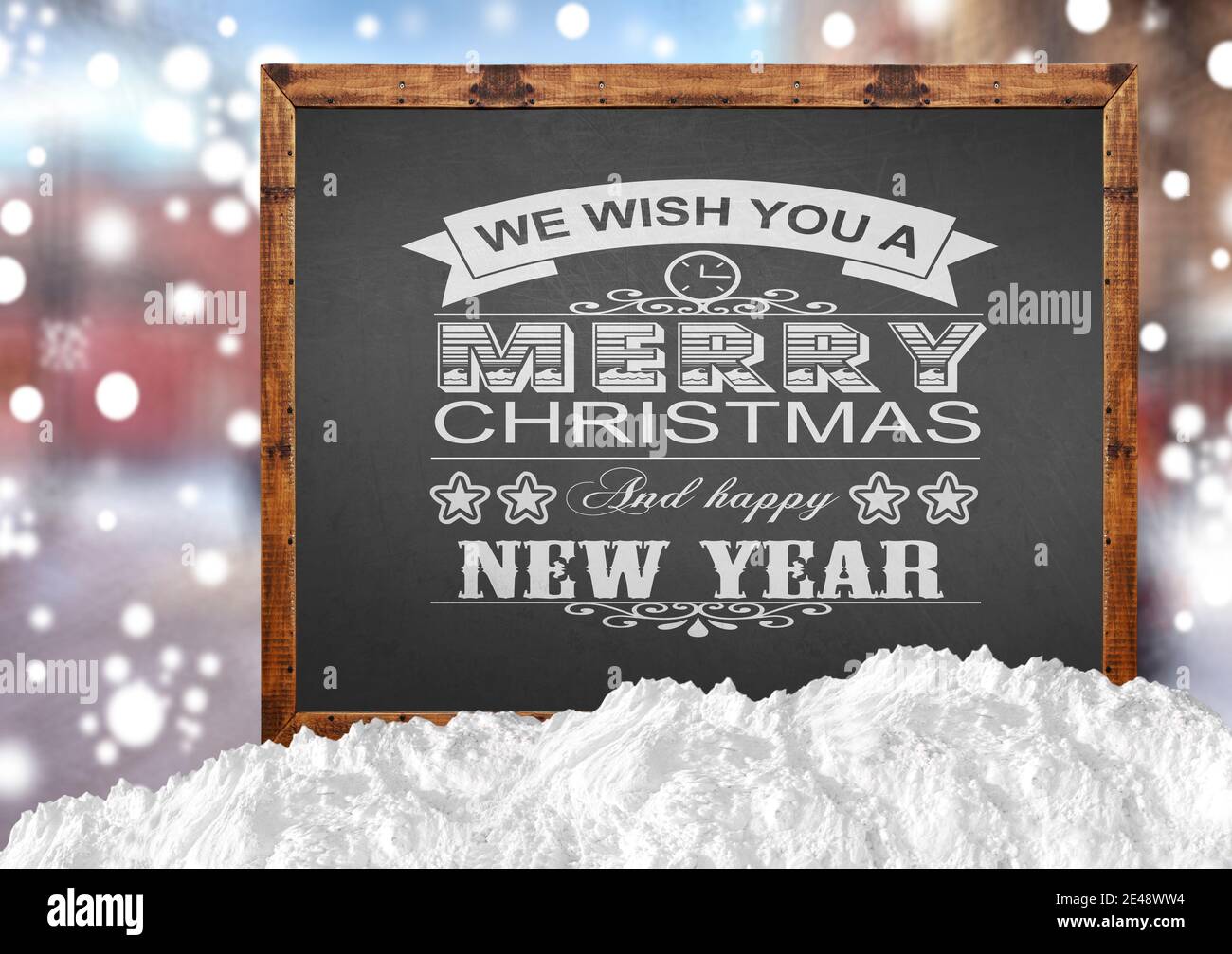 Merry Christmas and Happy New Year on blackboard with leaves and snow ...