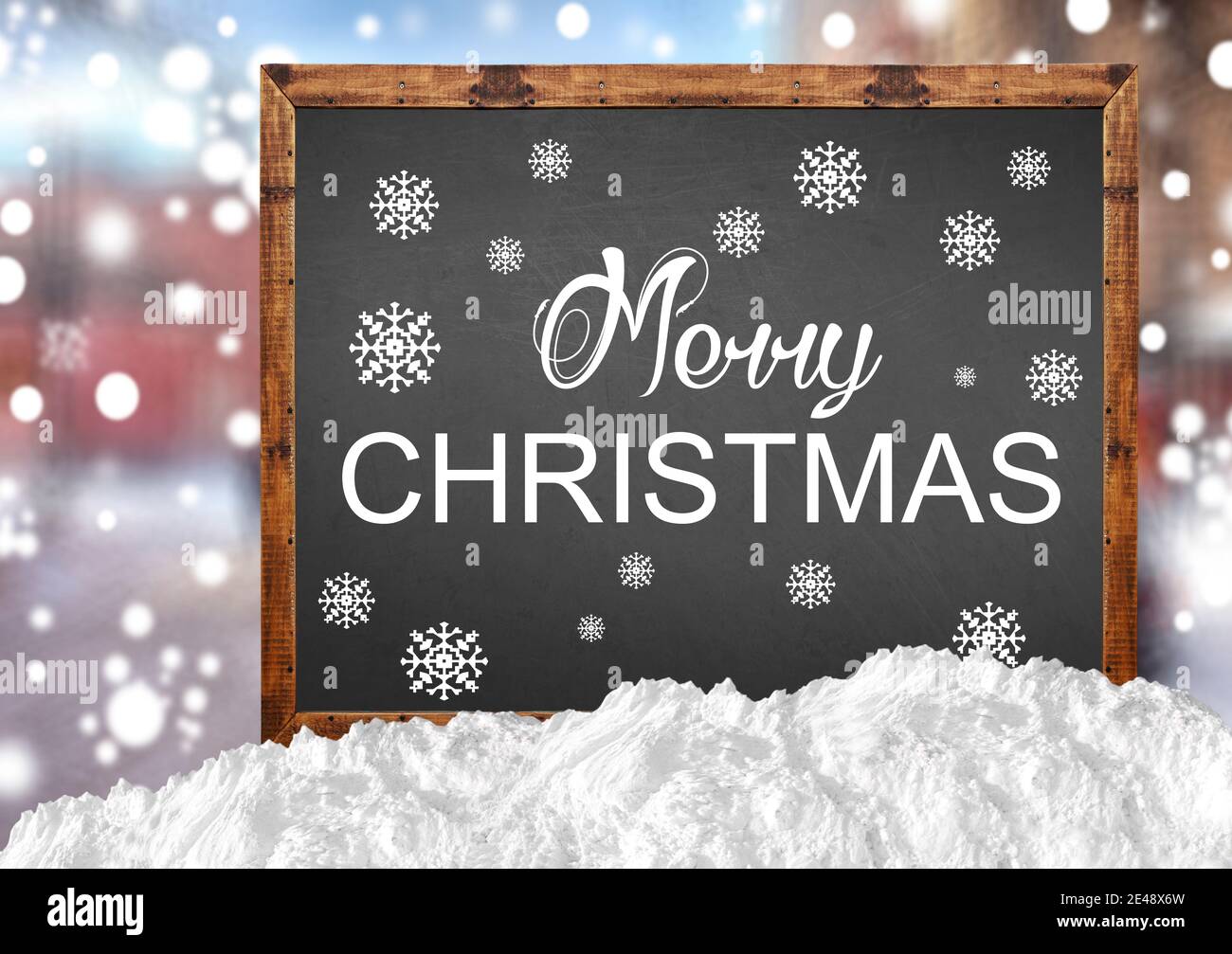 Merry Christmas and Happy New Year on blackboard with leaves and snow ...