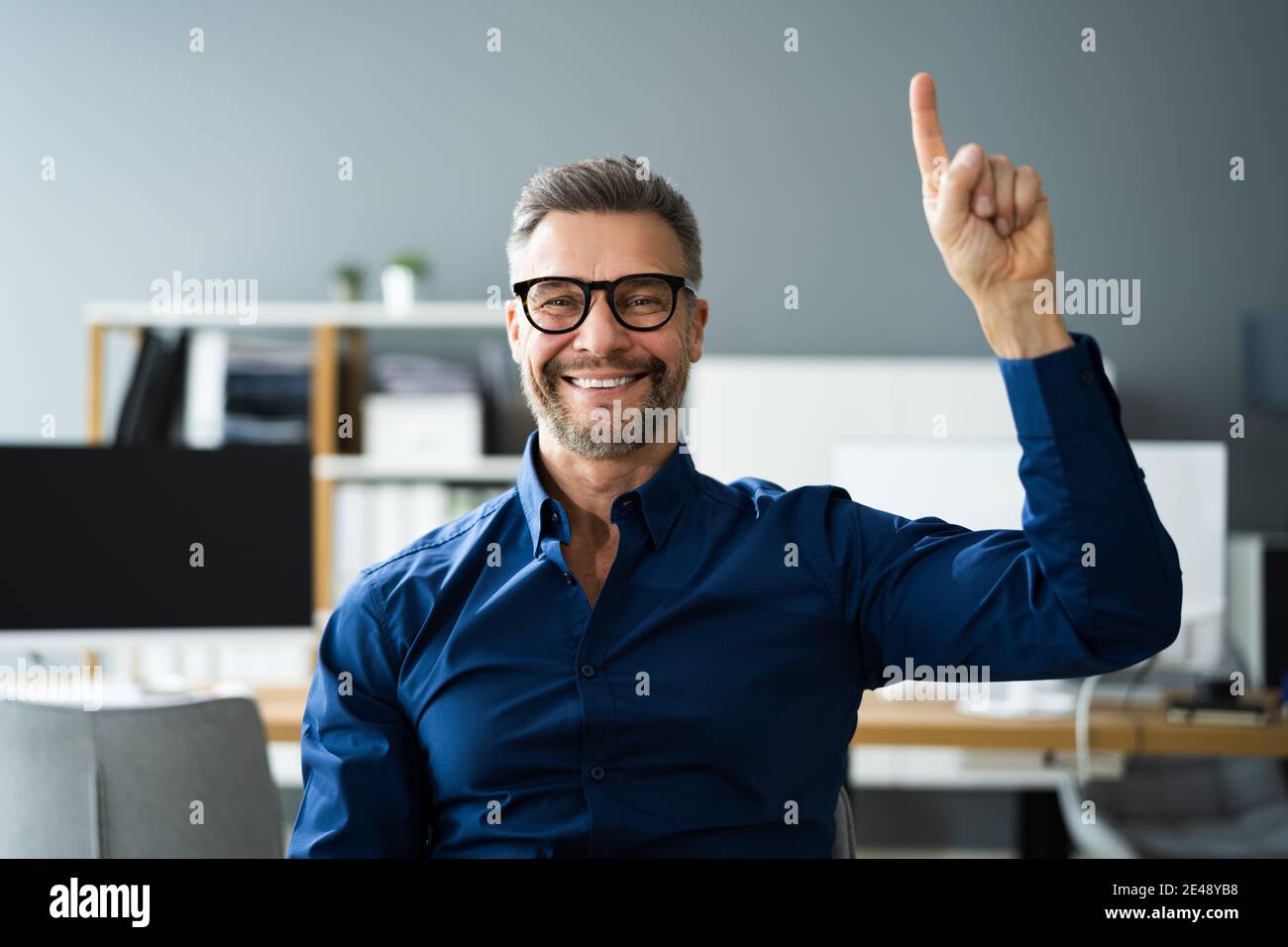 Raising hand ask questions hi-res stock photography and images - Alamy