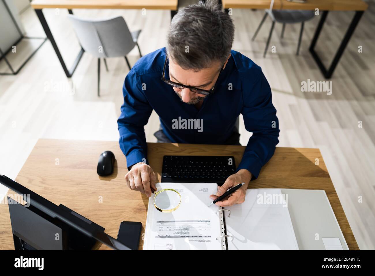 Fraud Detective Using Magnifying Glass Or Loupe Stock Photo - Alamy