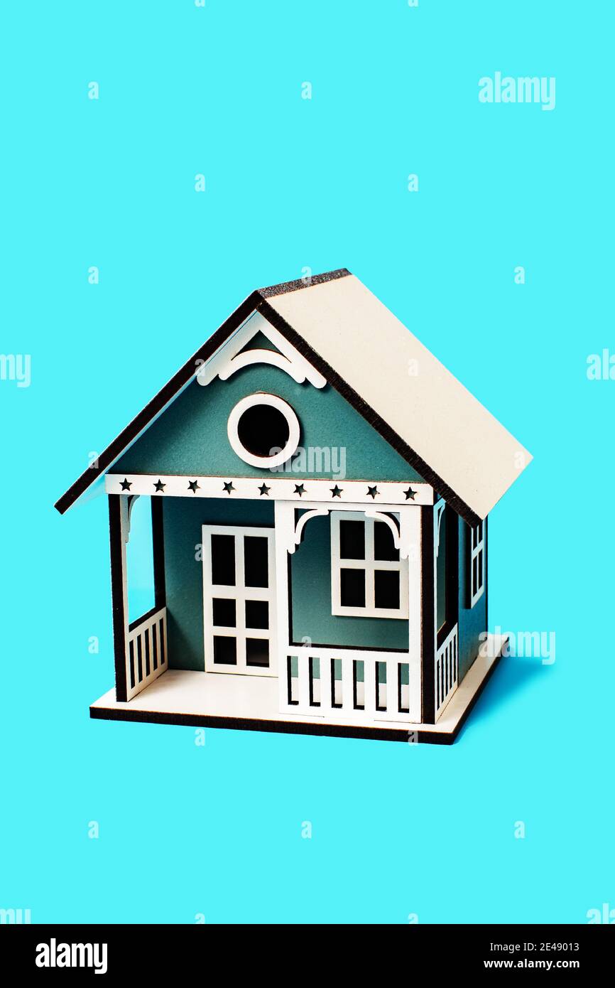 Minimal cute house isolated on blue background Stock Photo - Alamy