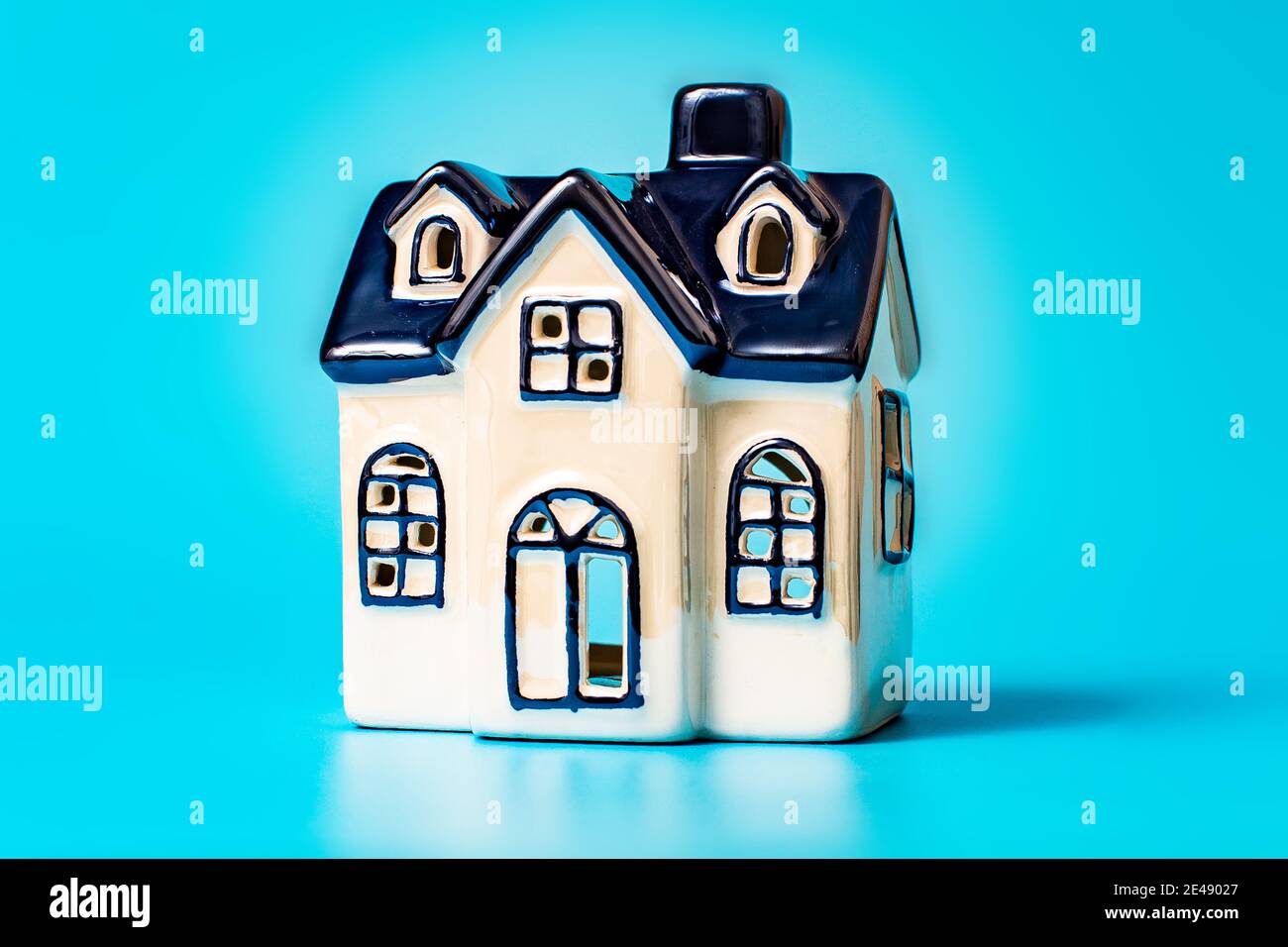 Minimal cute house isolated on blue background Stock Photo - Alamy