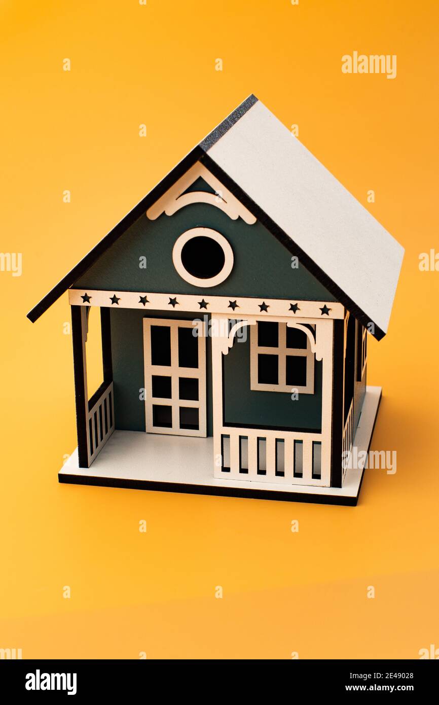 Minimal cute house isolated on yellowl background Stock Photo - Alamy