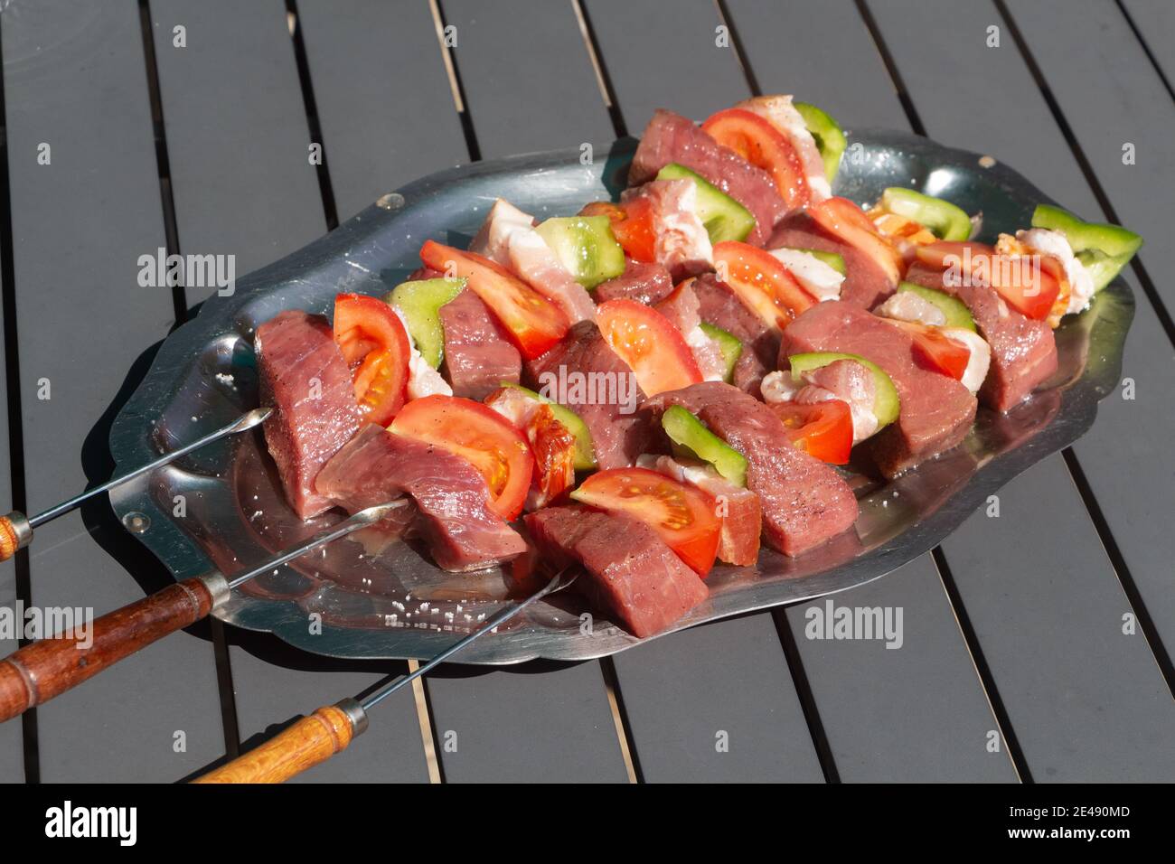 Beef and vegetable brochettes on a dish Stock Photo - Alamy