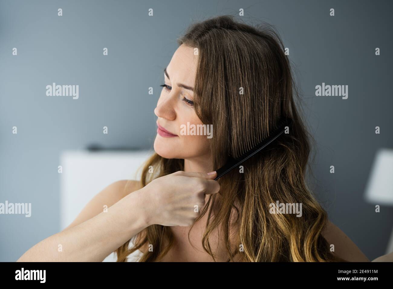 Straight hair combing hi-res stock photography and images - Alamy