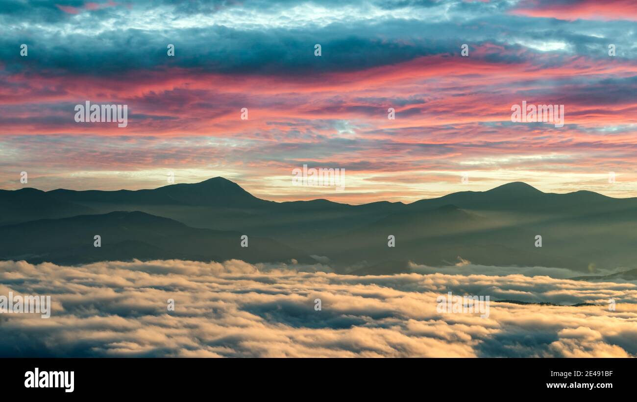 Amazing flowing morning fog in spring mountains. Beautiful sunrise on ...