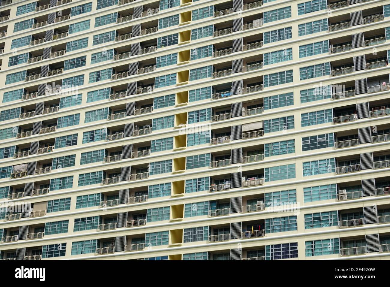Low angle of apartment building with colorful painted facade and small ...