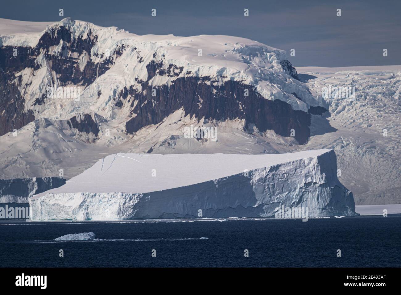 Iceberg and snowy mountains in Antarctica Stock Photo - Alamy