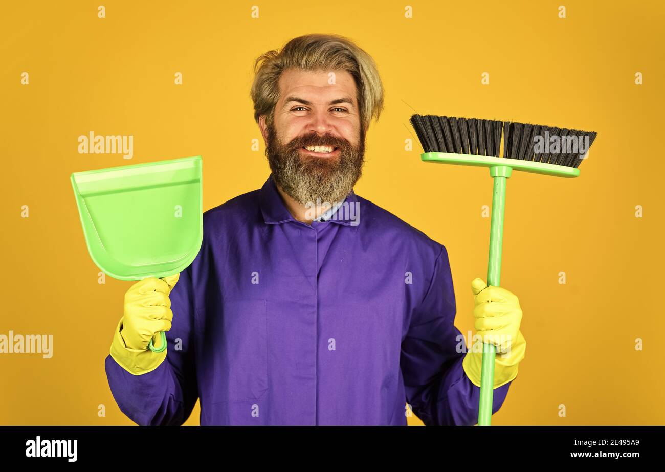 clean up. bearded man cleaning with mop. Janitor in gloves. husband ...