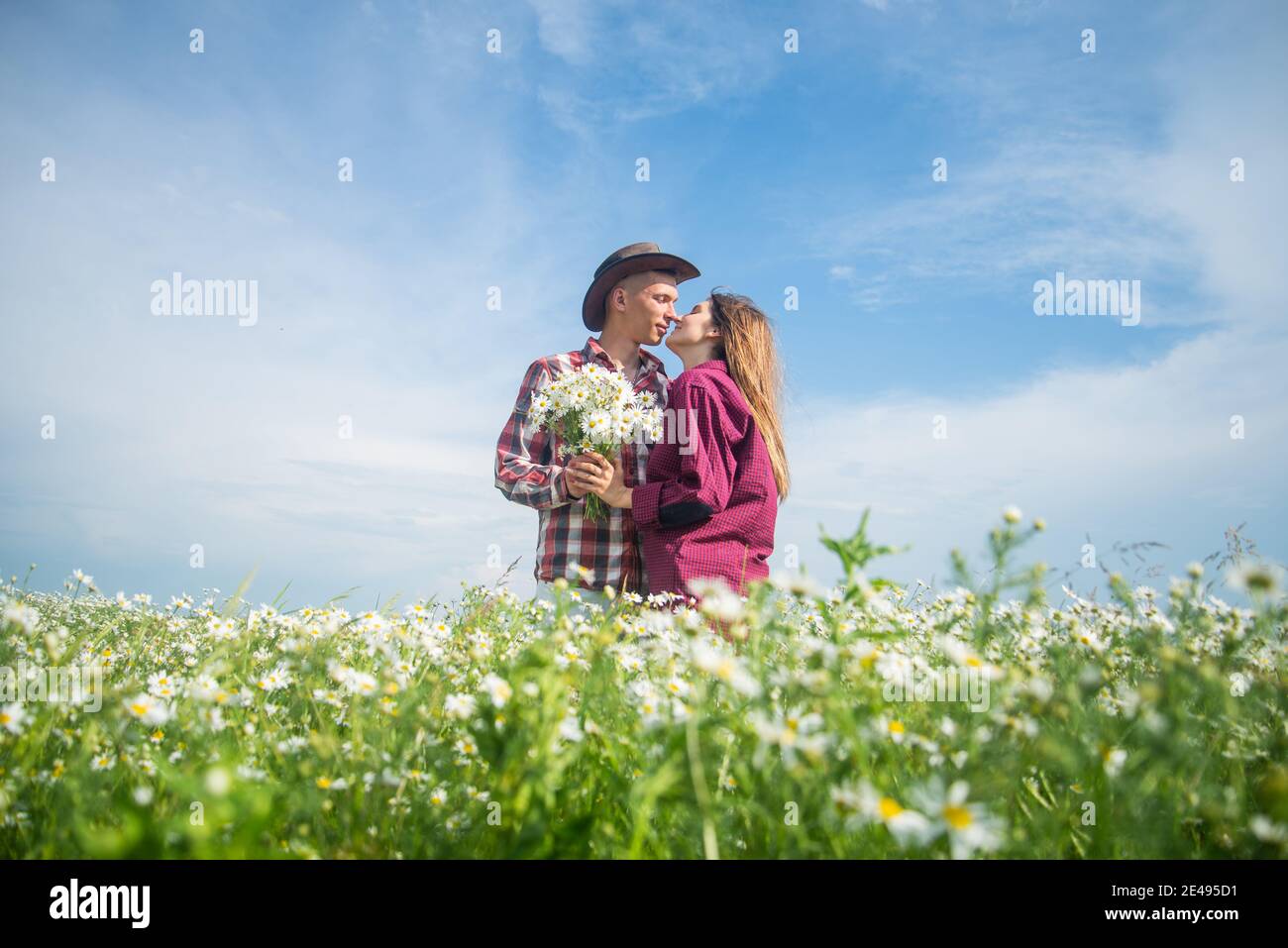 Sunshine portrait of happy couple outdoor in nature location at sunset ...