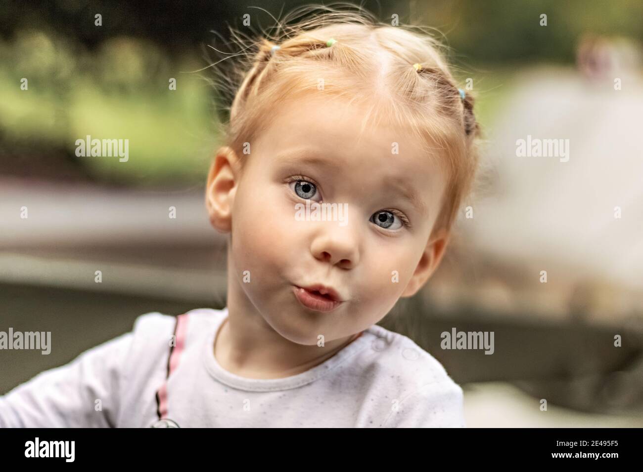 Portrait of a small girl in close-up. Emotions Stock Photo - Alamy