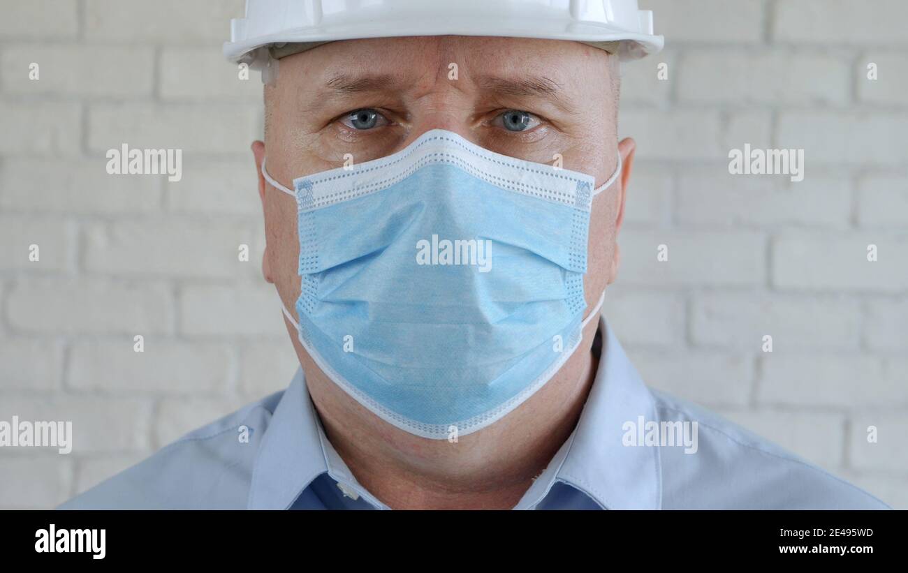 Confident Image with an Engineer Wearing Face Protection Mask Against ...