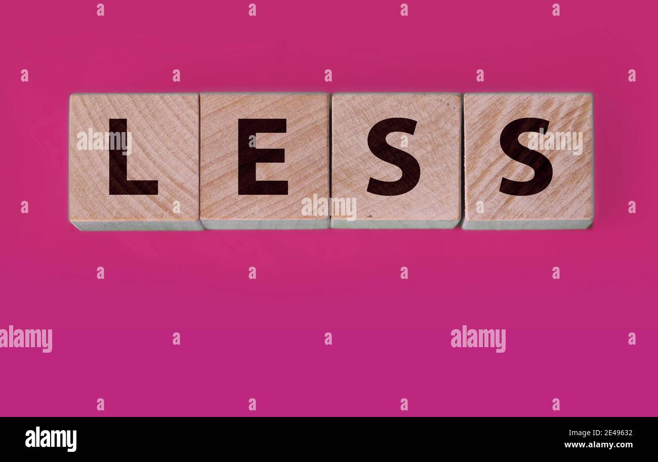 Less word on wooden cubic blocks with letters. Spend less or cut costs ...