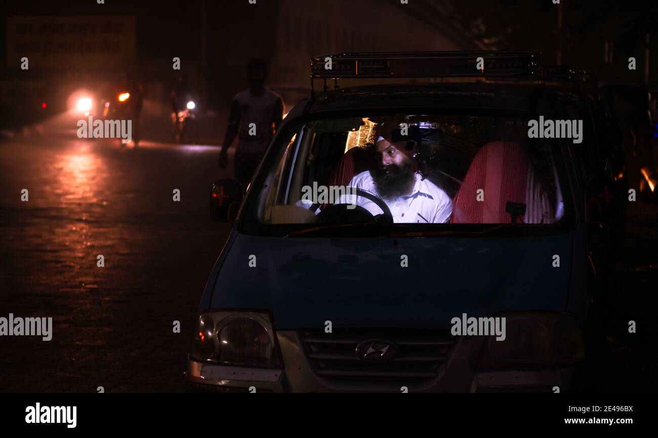 MUMBAI, INDIA - December 17, 2020 : A Sikh taxi driver seating inside a ...