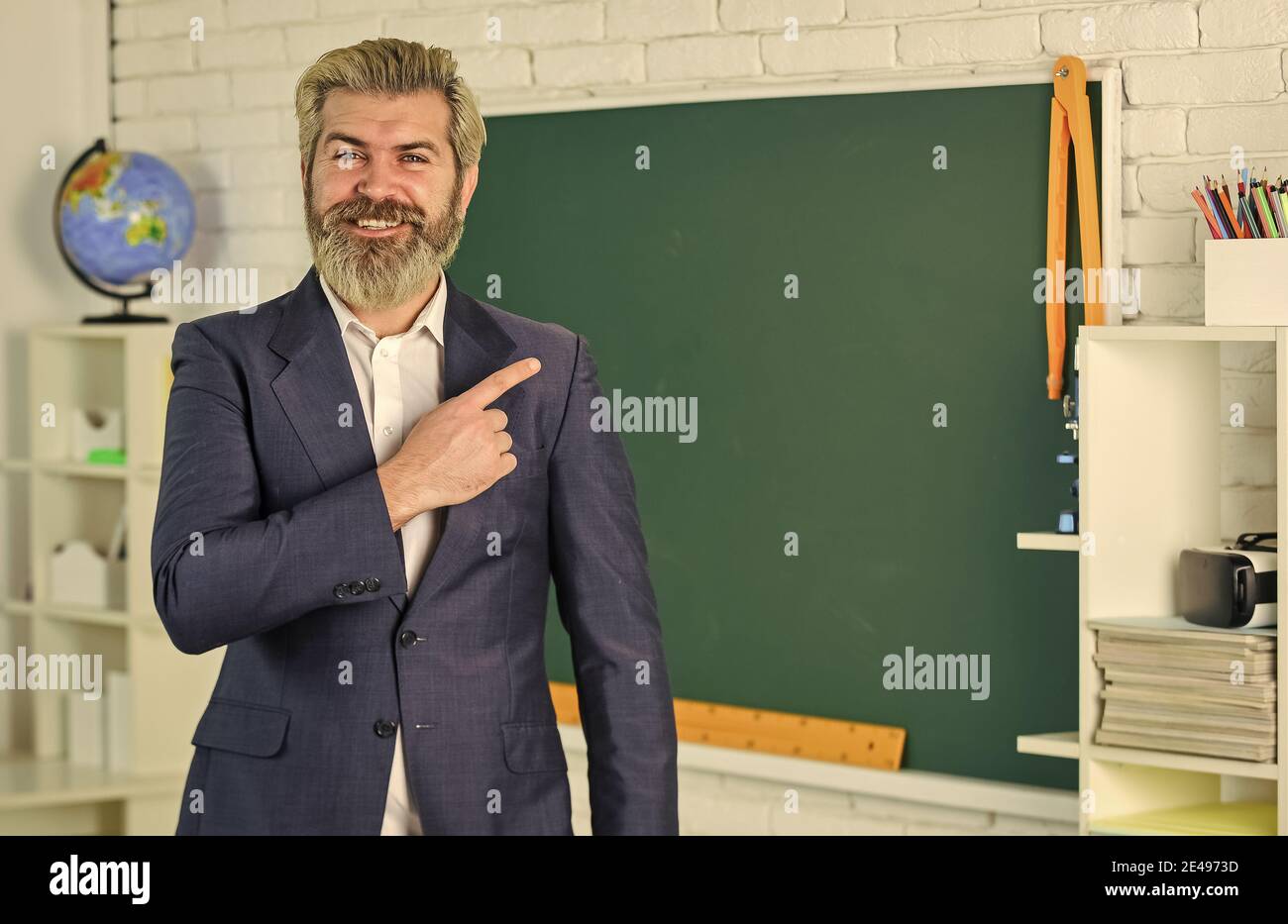 Knowledge day. Back to school. Teachers day. Bearded man in classroom ...