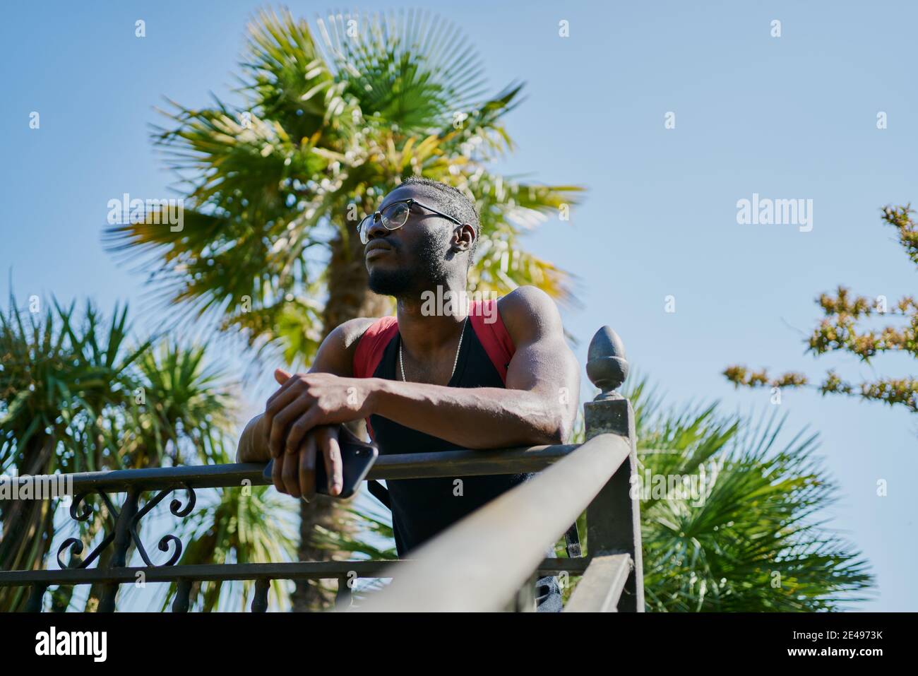 Man leaning on railing hi-res stock photography and images - Alamy