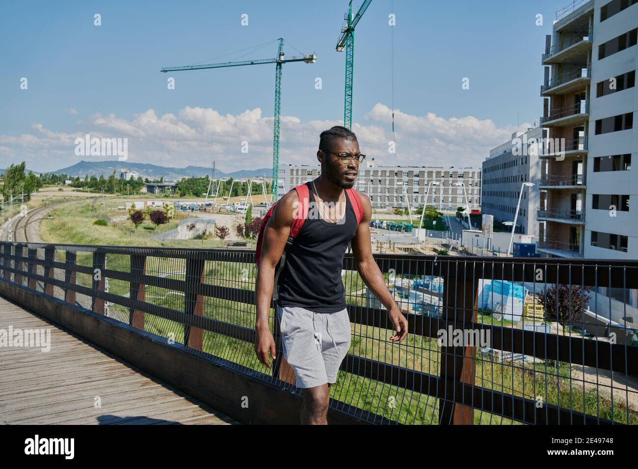 Man walking over bridge hi-res stock photography and images - Alamy