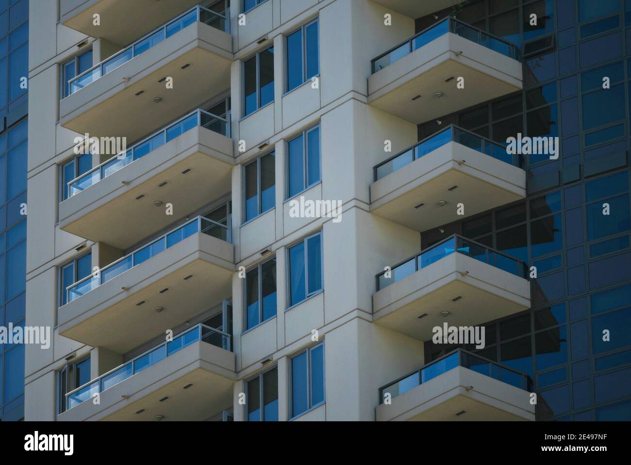 Exterior view of a high-rise residential building with symmetrical ...