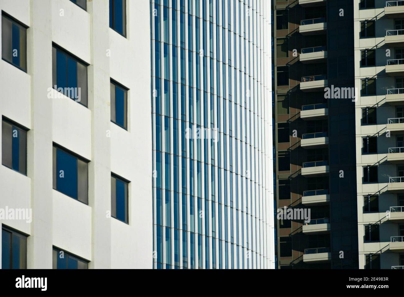 Modern high-rise buildings exterior close-up view with white concrete ...