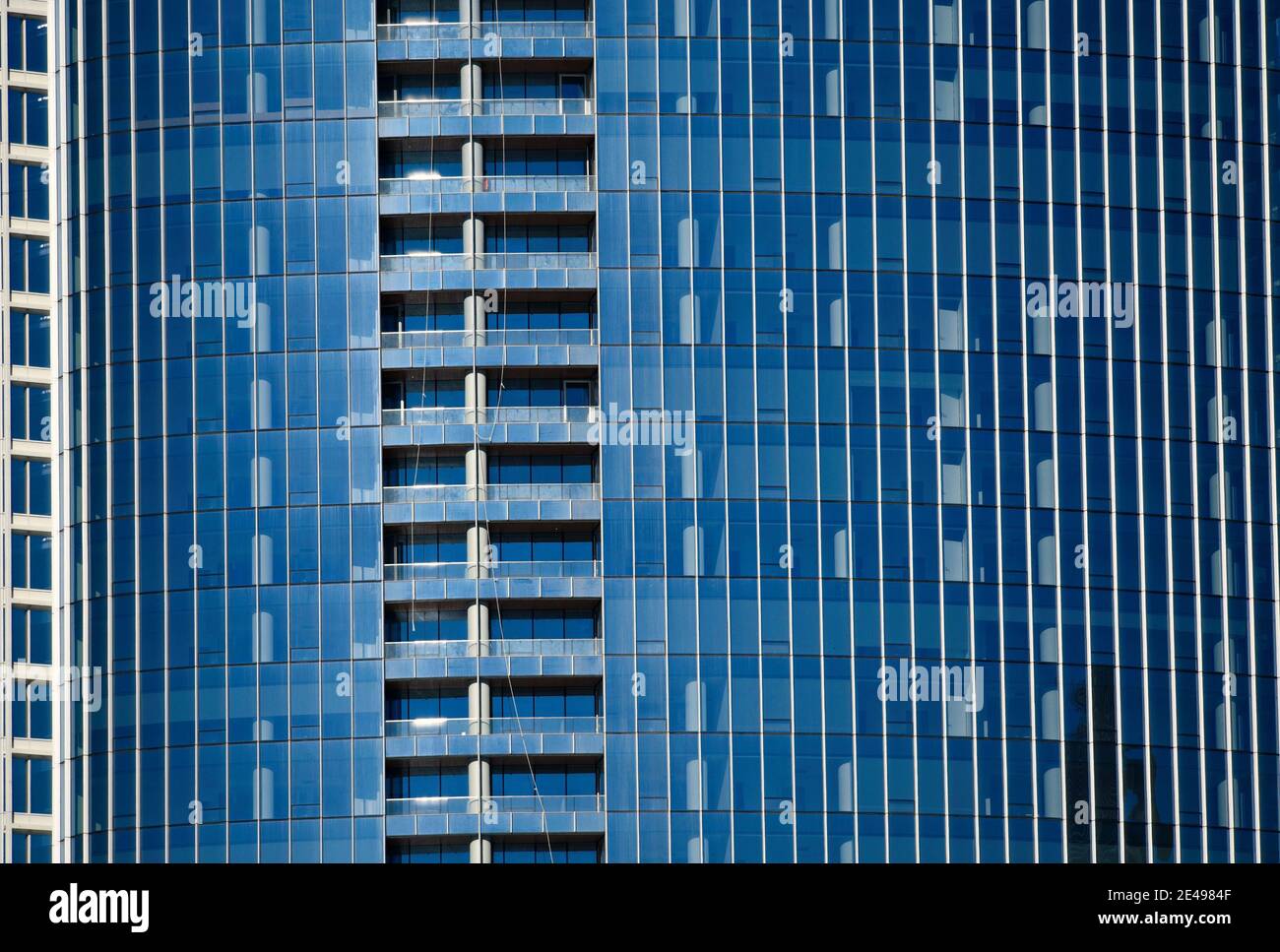Steel and blue glass facade of a high-rise corporate offices building ...