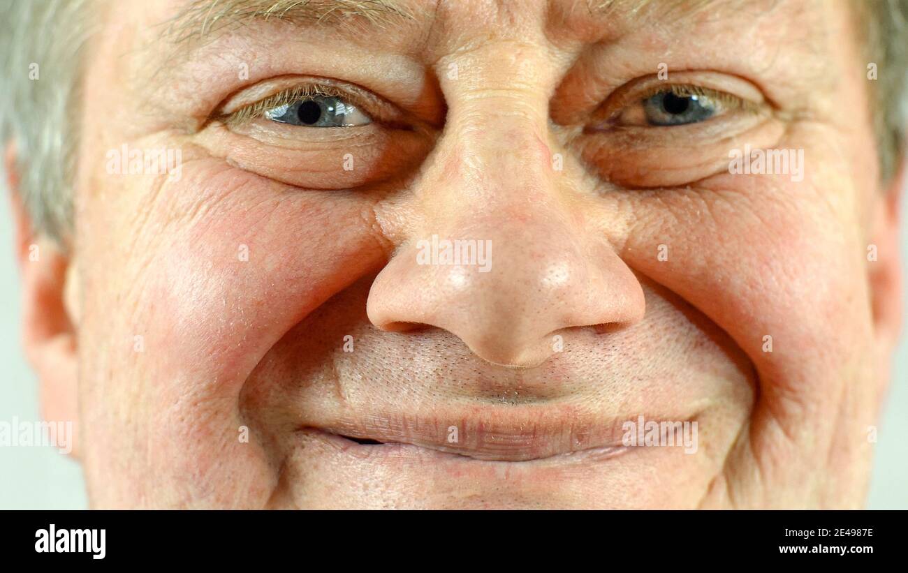 Front portrait of mature adult mans face which smiling. Wrinkle skin ...