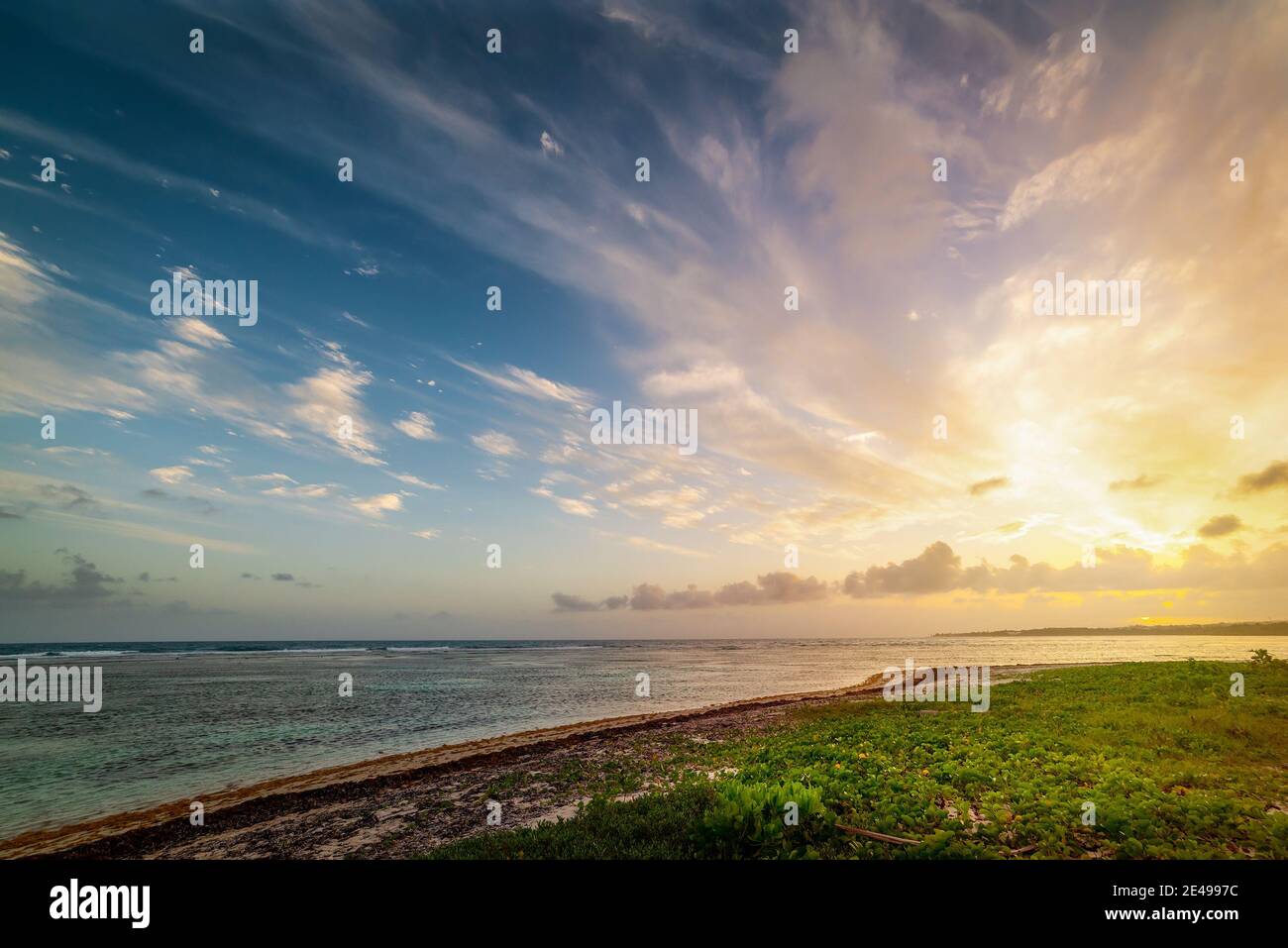 Clear sky over Bois Jolan beach at sunset. Guadeloupe, Caribbean sea ...