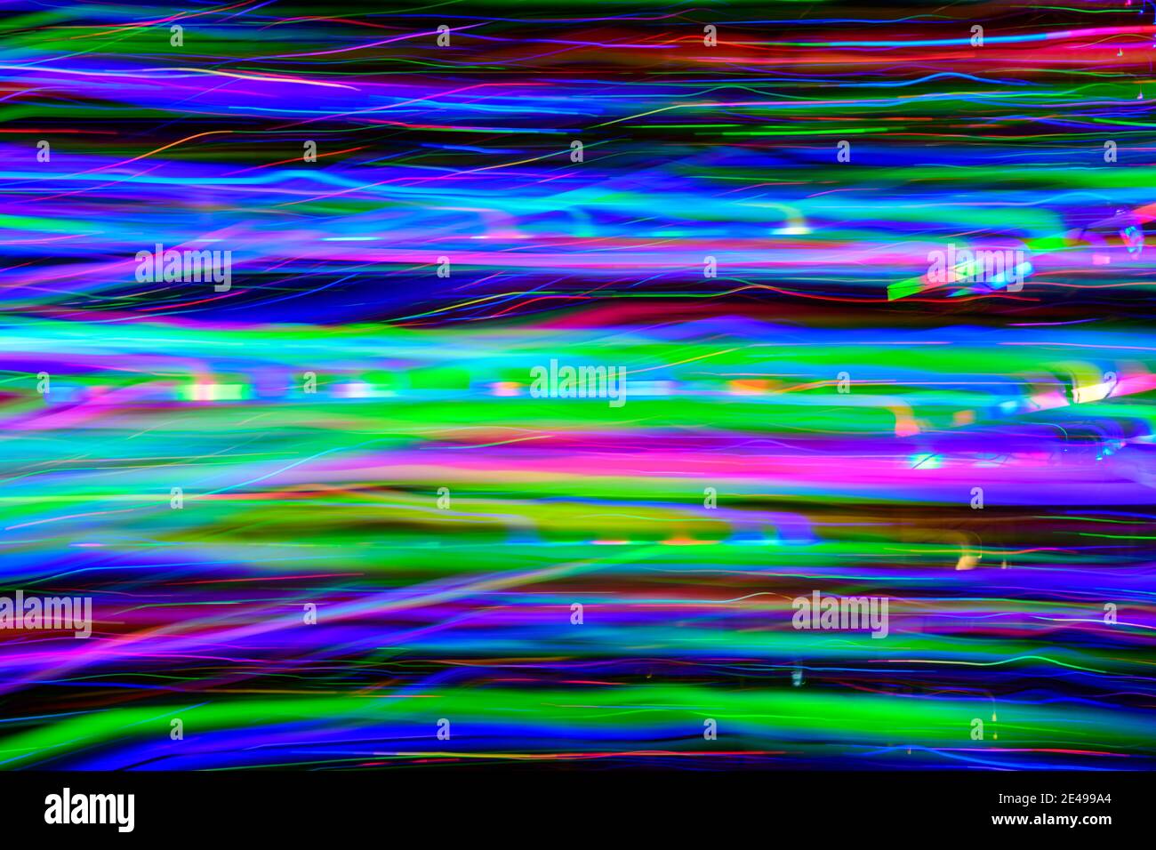 Defocused horizontal movement of green, blue, yellow, and pink created ...