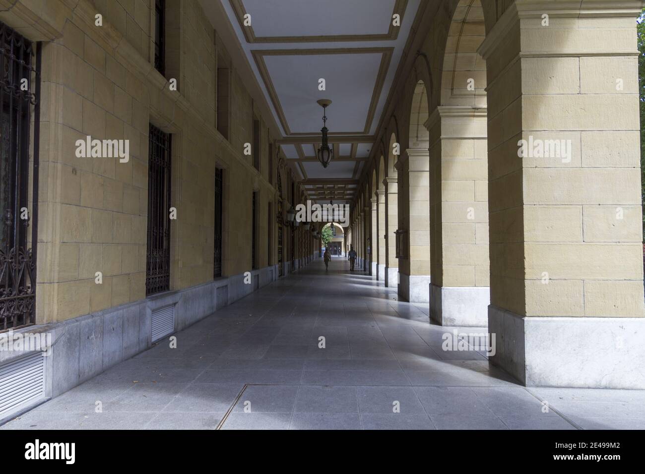 Pathway under the building with giant arches with pillars Stock Photo ...