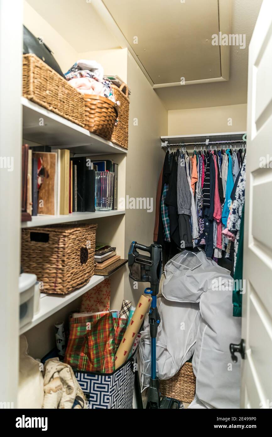 A messy and unorganized walk in closet Stock Photo - Alamy