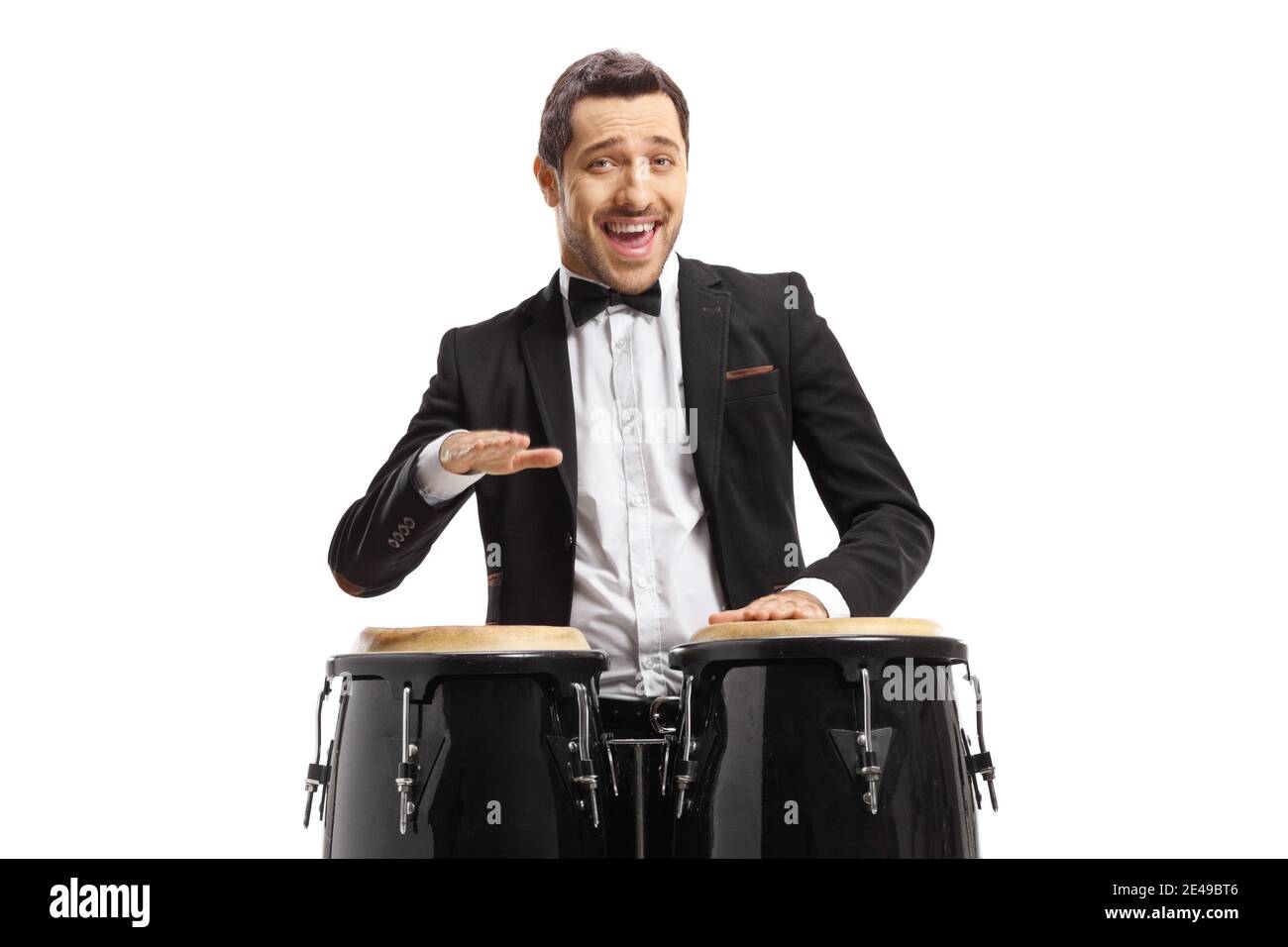 Man in a suit playing conga drums isolated on white background Stock ...