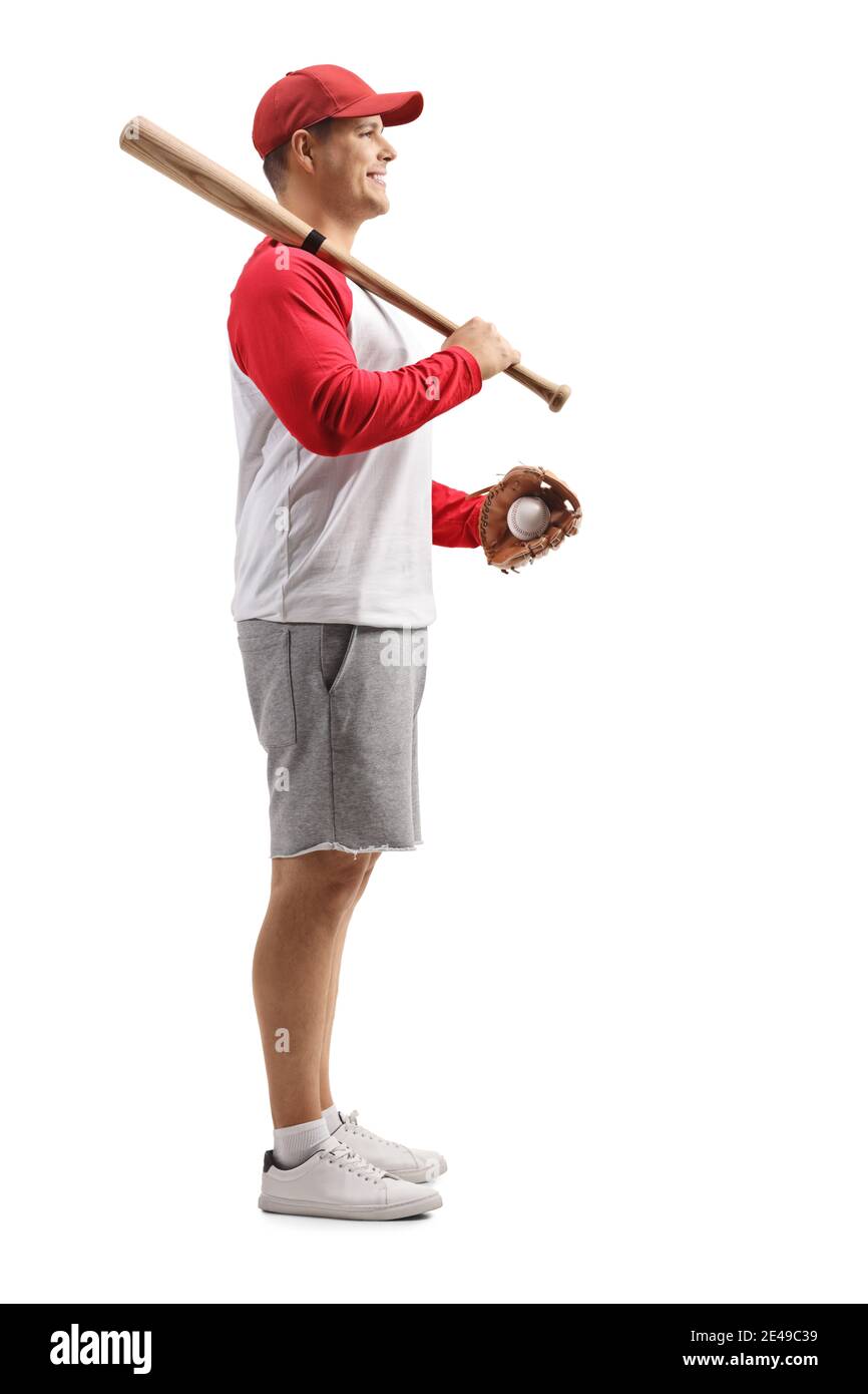 Full length profile shot of a man with a baseball bat, glove and ball ...