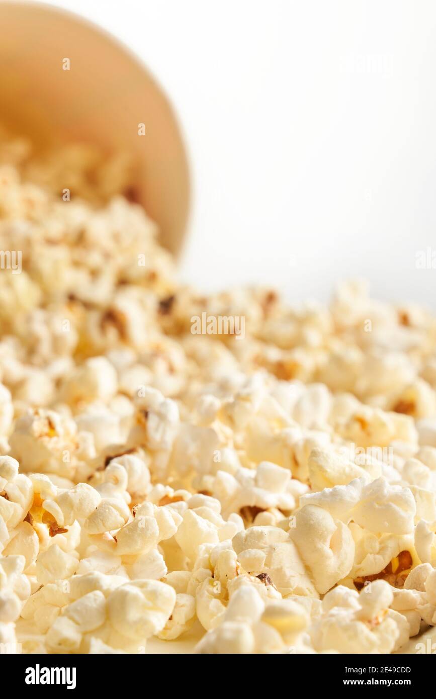 Scattered popcorn in carton cup. Concept blurred popcorn background ...