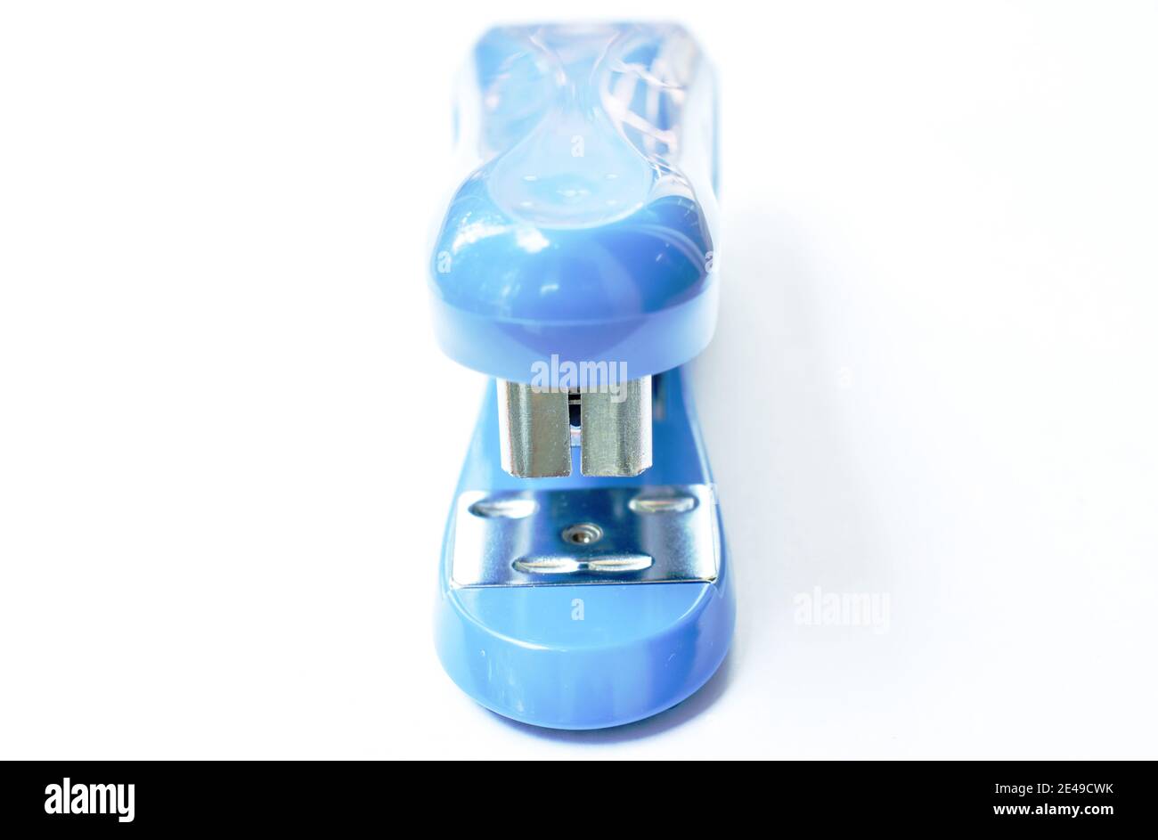 big blue stapler for pushing paper on white background Stock Photo - Alamy