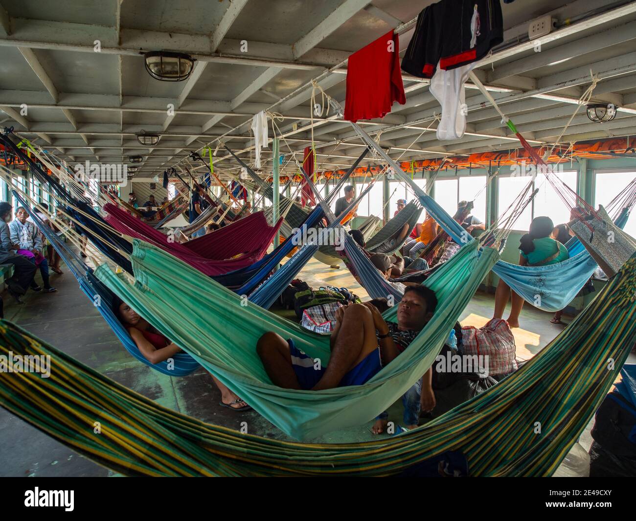 Amazon River, Peru - Sep 19, 2019: People on the hammocks on the cargo ...