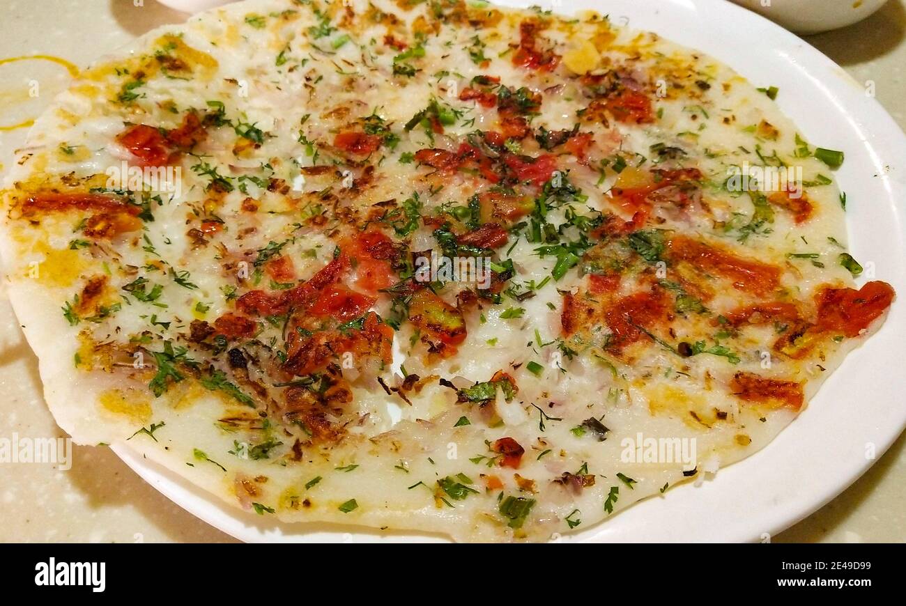 South Indian Food Uttapam or ooththappam or Uthappa is a dosa-like dish ...