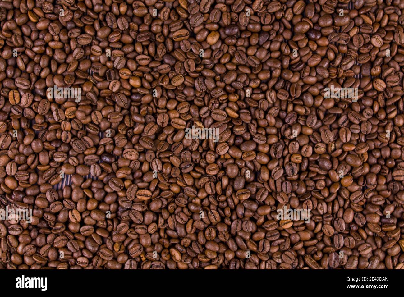 a many roasted coffee beans lie together Stock Photo - Alamy