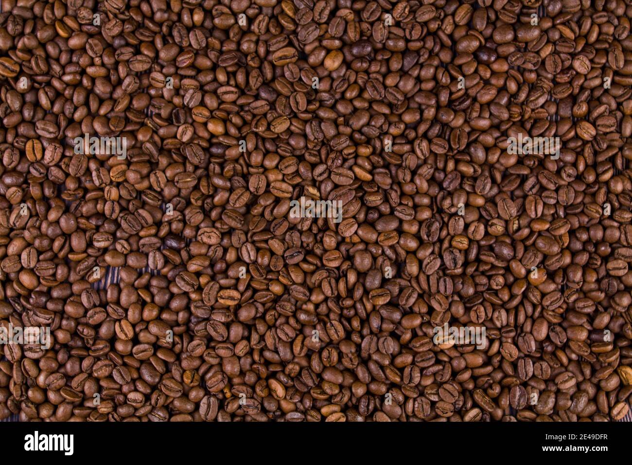 a many roasted coffee beans lie together Stock Photo - Alamy