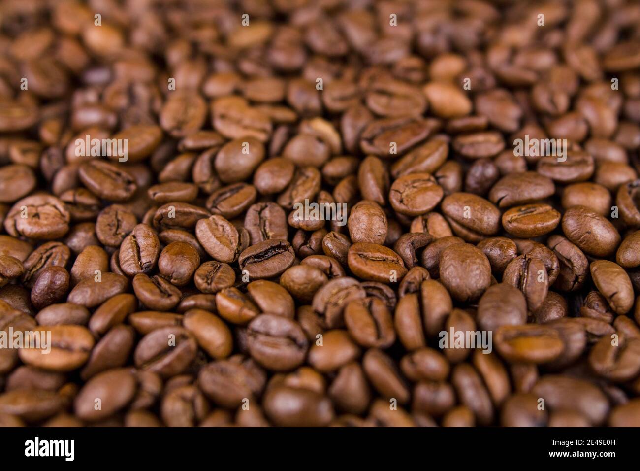 a many roasted coffee beans lie together Stock Photo - Alamy