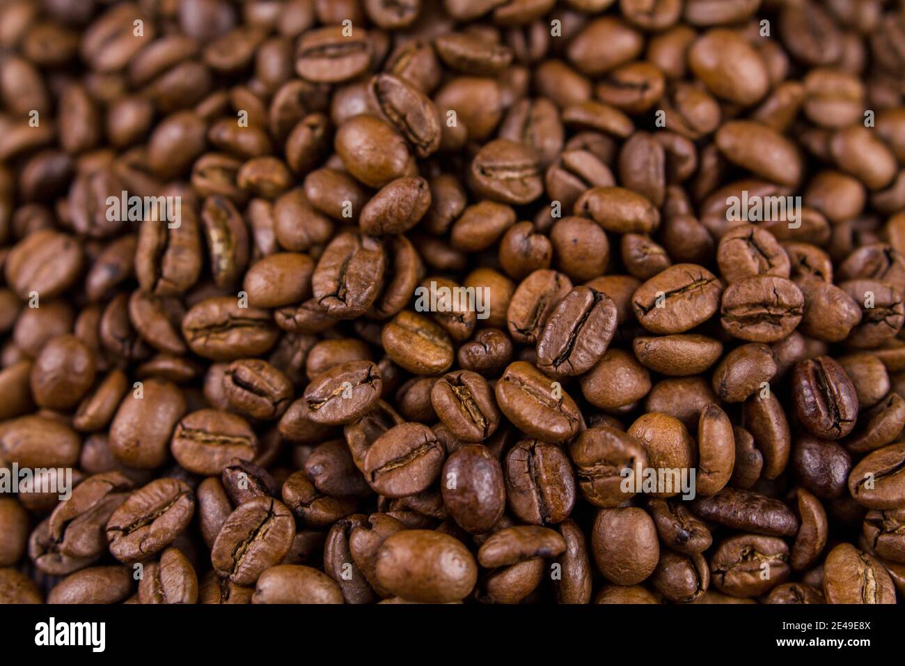 a many roasted coffee beans lie together Stock Photo - Alamy
