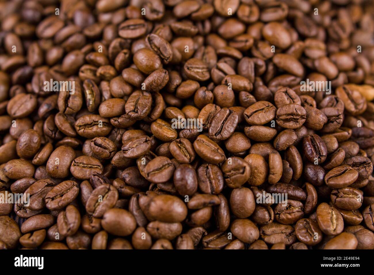 a many roasted coffee beans lie together Stock Photo - Alamy
