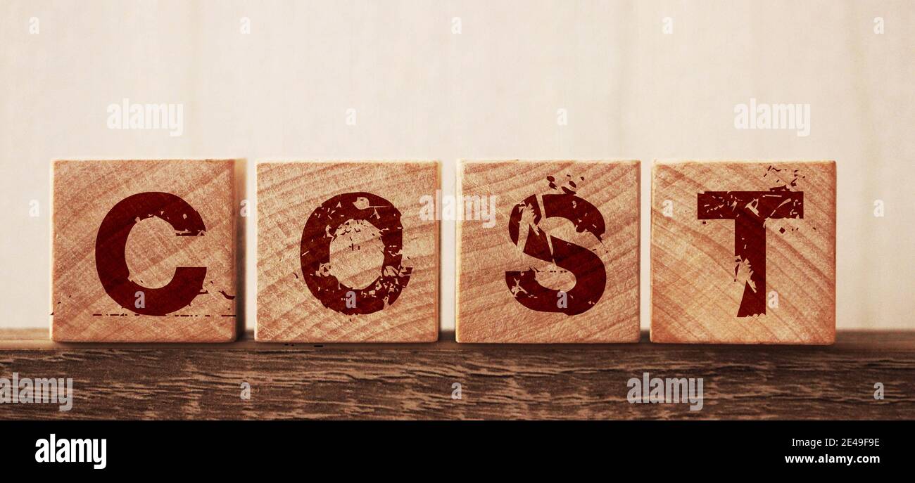 Costs word written on wooden blocks. Financial business expences ...